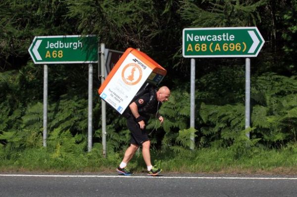 This Man Runs Marathons with a 93-Pound Refrigerator Strapped to His ...